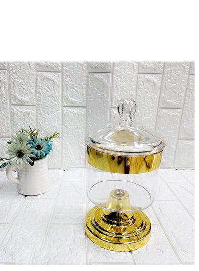 Transparent glass candy bowl with belt and golden base, elegant design ...